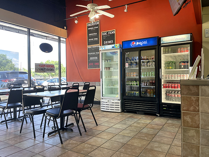 No-frills interior with vibrant red walls that say, "We're not here to impress you with decor. We're here to blow your mind with cheesesteaks."