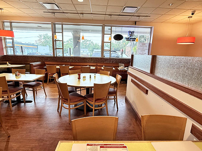 Cozy booths, warm lighting, and tables ready for serious eating. This isn't Instagram-bait décor—it's the authentic stage where sandwich magic happens daily.