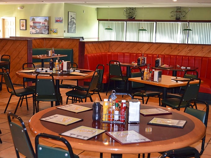 Classic red vinyl booths and wood paneling create the perfect backdrop for morning conversations and coffee refills that never seem to end.
