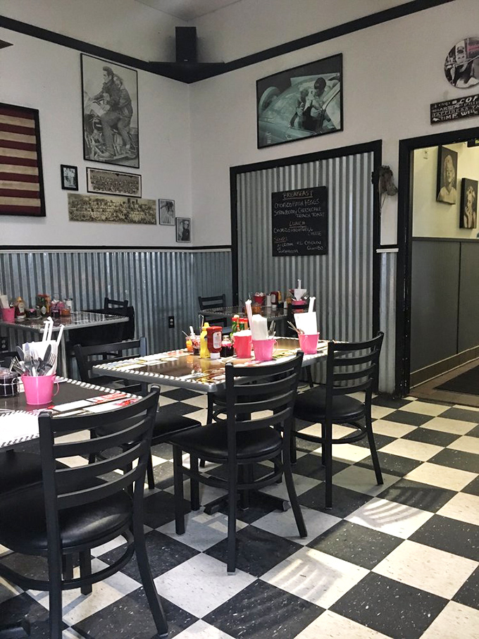Retro heaven with corrugated metal wainscoting and vintage photos. This isn't manufactured nostalgia&mdash;it's the real deal, complete with pink silverware holders.