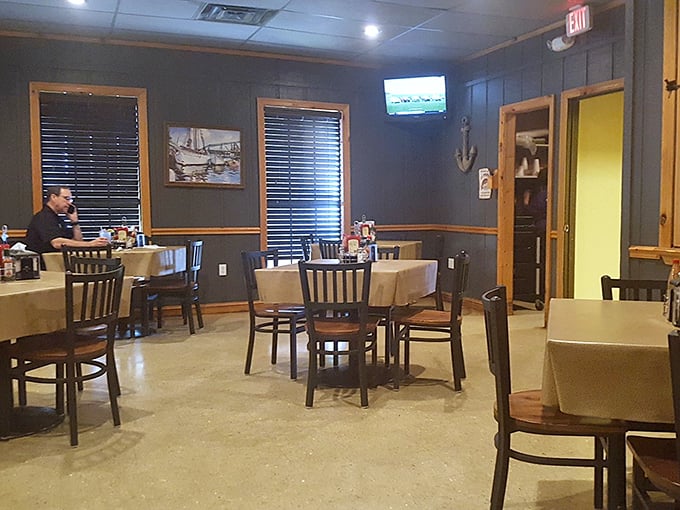 Wooden Windsor chairs and mounted fish create that perfect "grandpa's cabin meets seafood joint" vibe. Come for the catfish, stay for the rustic charm.