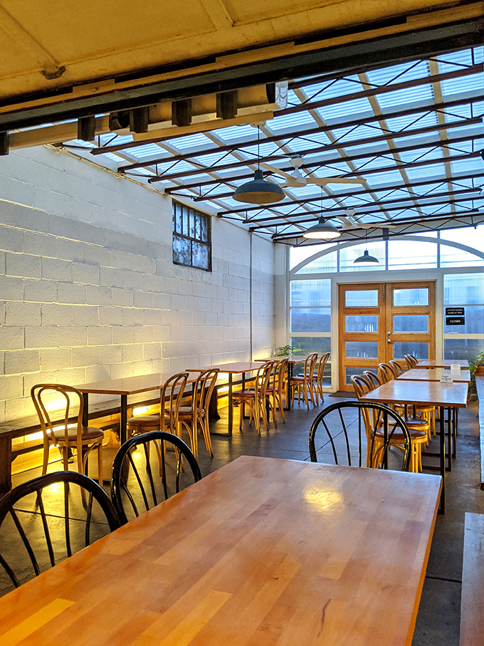 Minimalist magic happens inside these white-washed walls, where bentwood chairs and wooden tables create the perfect canvas for plant-based Polish masterpieces.