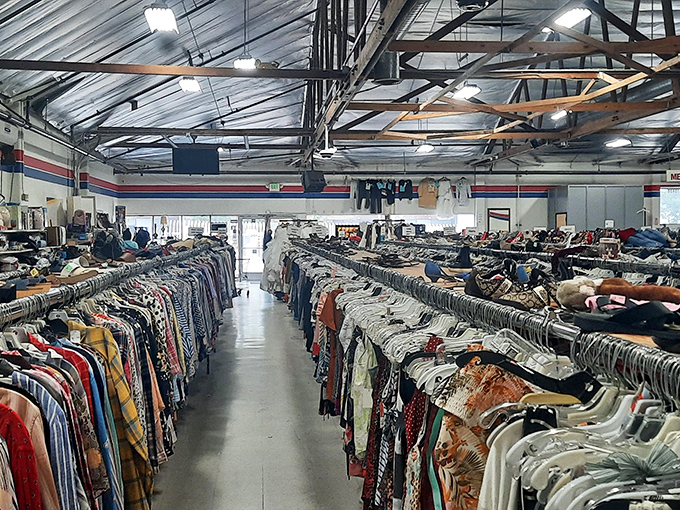 Clothing racks stretch toward infinity under exposed beams. This isn't shopping&mdash;it's an archaeological expedition through the strata of California fashion history.