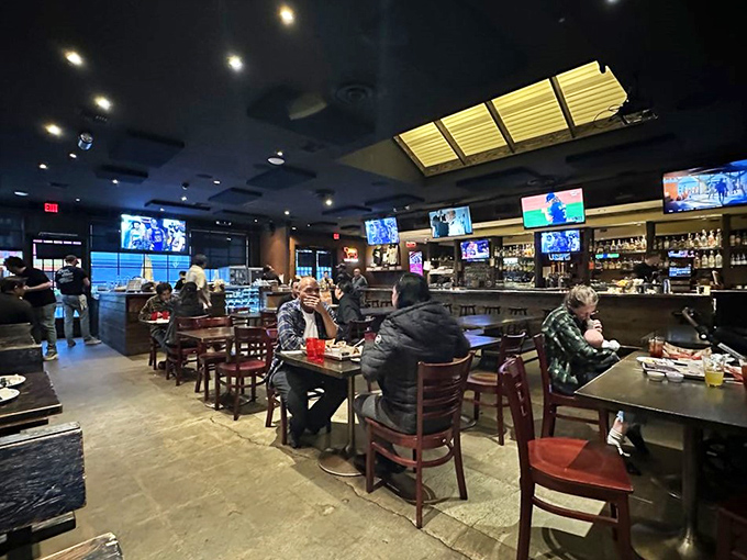 Inside Bludso's, the modern sports bar atmosphere proves great BBQ doesn't need sawdust floors and paper towel rolls to be authentic.