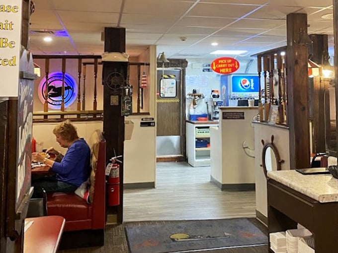 Nautical New England comes alive inside with wooden beams, ship wheels, and cozy booths where seafood dreams and dinner conversations flow equally well.