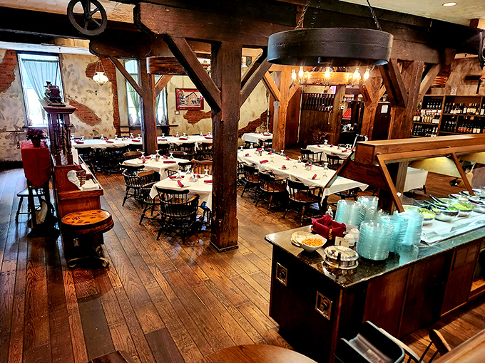 Exposed beams and weathered brick create a dining room where every table feels like the best seat in a museum that serves incredible food.