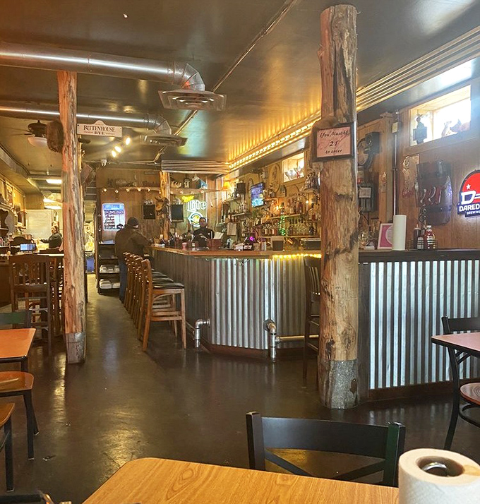 Rustic wooden posts and corrugated metal create that perfect "discovered gem" atmosphere where you know the food matters more than fancy decor.