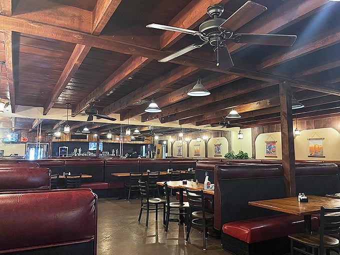 Exposed beams and red vinyl booths create the perfect steakhouse atmosphere where memories are made over meat.