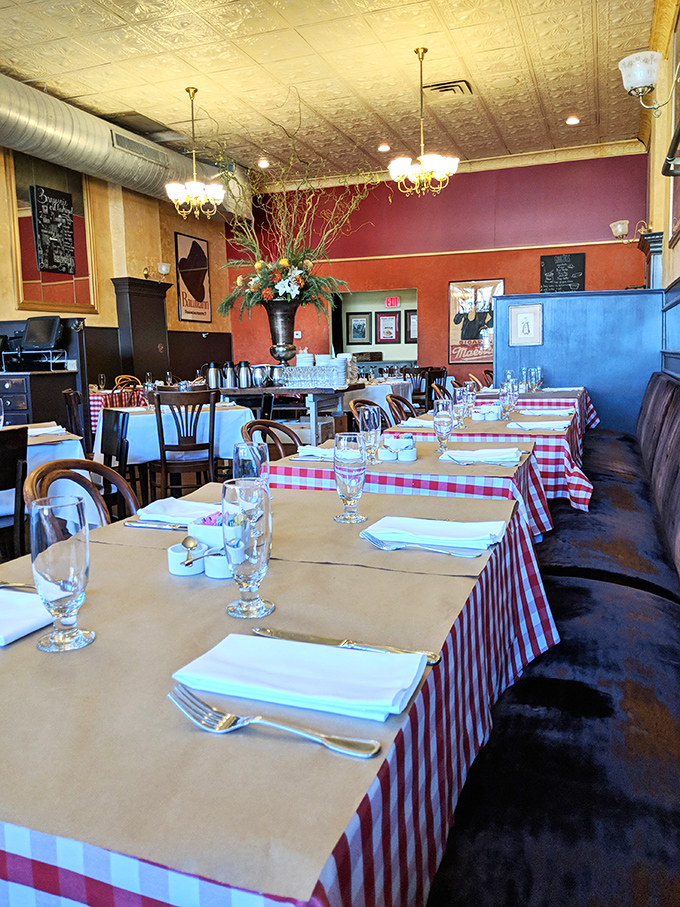 Red checkered tablecloths and warm lighting transform simple dining into an occasion. This isn't just a meal—it's your passport to France without the jet lag.