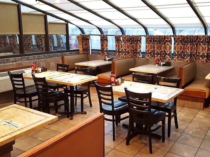 Step into dining comfort where every booth whispers promises of perfectly prepared morning meals ahead.