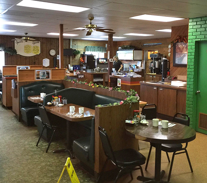 Classic Americana at its finest—wood paneling, cozy booths, and that unmistakable diner charm that whispers, "Your diet starts tomorrow."