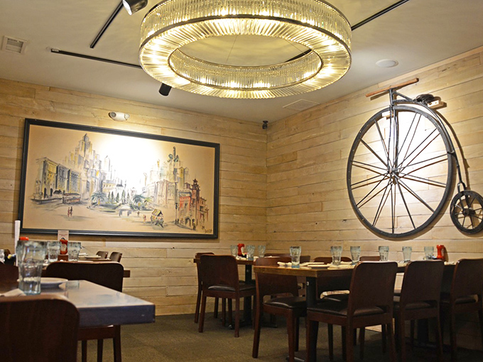 Rustic elegance defines this dining space where a vintage bicycle hangs alongside contemporary lighting&mdash;proof that rural Missouri knows a thing or two about atmosphere.