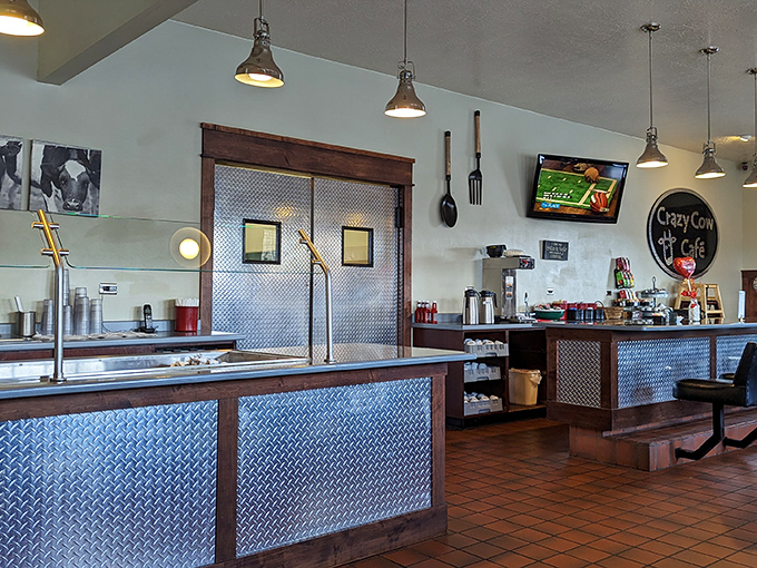 Industrial chic meets farmhouse comfort inside, where diamond plate metal and pendant lighting create the perfect backdrop for serious eating business.