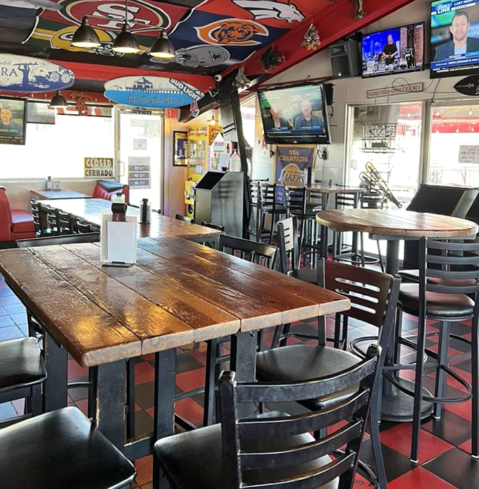 Sports memorabilia adorns every inch of ceiling space, creating that perfect "third place" where strangers become friends over shared fandom and fries.