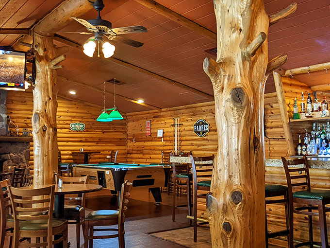 Those tree trunk columns aren't just supporting the ceiling&mdash;they're holding up generations of mountain cooking tradition. Nature meets nurture.