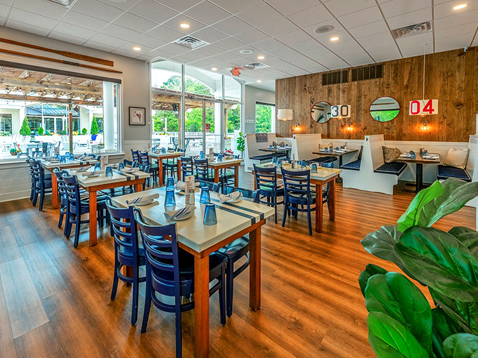 Warm wood tones, nautical accents, and plenty of natural light create a dining room that's both sophisticated and comfortable. No pretension, just good vibes.