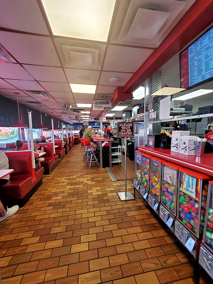 Red vinyl booths and retro charm create the perfect backdrop for comfort food indulgence. Even the floor tiles look deliciously vintage.