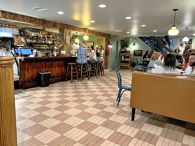 The warm interior balances rustic charm with casual comfort, creating the perfect backdrop for food that demands your full attention.