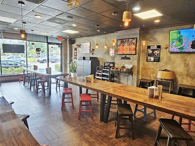 Inside, communal wooden tables and warm lighting create the perfect backdrop for the flavor explosion that's about to happen.