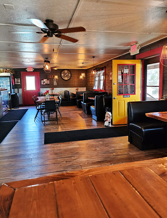 Step inside and you're transported to barbecue heaven. The yellow door, Edison bulbs, and wood-paneled walls create the perfect backdrop for the meat-centric magic about to unfold.