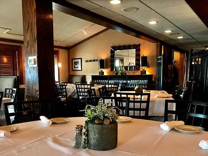 White tablecloths and warm wood tones create that perfect "special occasion that feels like home" ambiance that Italian restaurants have perfected.