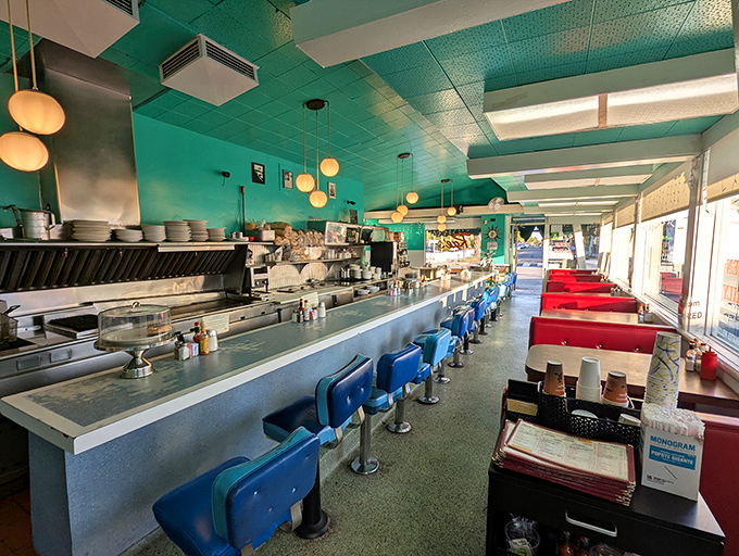 Step inside and you're transported to a simpler time&mdash;turquoise ceiling, blue counter stools, and red booths create the diner trifecta of perfection.