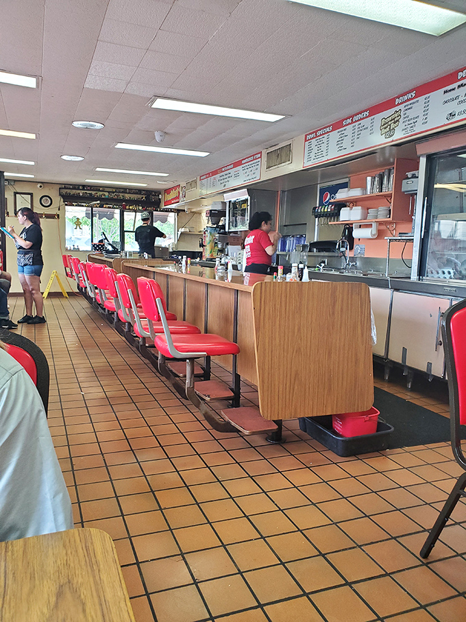 The counter seating at Brownie's is burger theater in the round&mdash;front row tickets to the sizzle show that's been running longer than most Broadway hits.