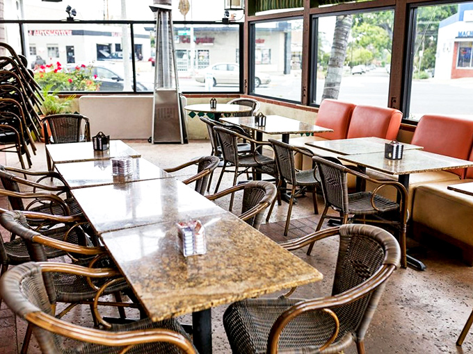 Sunlight streams through large windows, illuminating those classic woven chairs and granite tabletops&mdash;comfort never went out of style here.