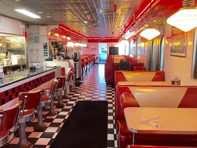 Step inside and time-travel to the golden age of diners—red vinyl booths, checkered floors, and counter seating that practically begs you to spin once before sitting.