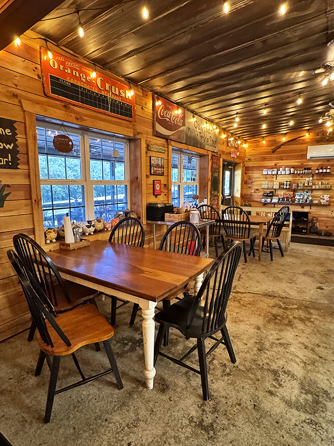 Classic diner aesthetics done right: red walls, checkered floors, and counter seating where breakfast dreams come true.