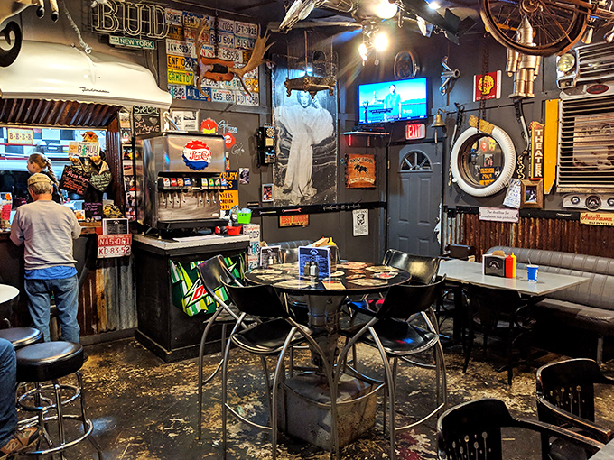 Where every inch tells a story: license plates, vintage signs, and enough automotive memorabilia to make car enthusiasts weep with joy while waiting for their burgers. 