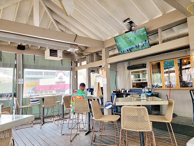 Coastal vibes meet Atlanta chic in this airy dining space. Those white ceiling beams practically whisper "beach vacation" while you're still in the city.