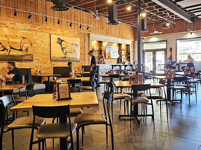 Rustic meets refined in this dining room where cow diagrams remind you exactly where your dinner came from. No mysteries here, just meat maps.