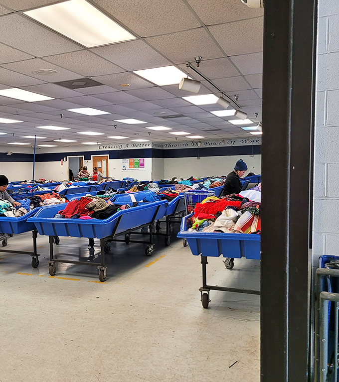 Blue bins as far as the eye can see, each one a potential goldmine of fashion finds and household treasures waiting to be discovered.