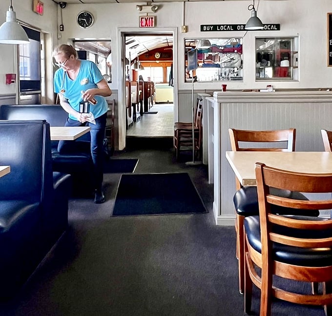 Classic booths, simple tables, and that "Buy Local or Bye Local" sign&mdash;this is New Hampshire's answer to comfort. No pretension, just honest hospitality.