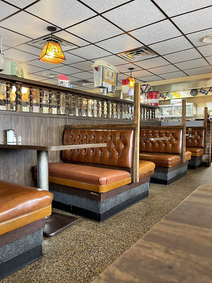 Classic diner booths where countless Ohio mornings have begun. These tufted vinyl seats have cradled more breakfast enthusiasts than a morning talk show.