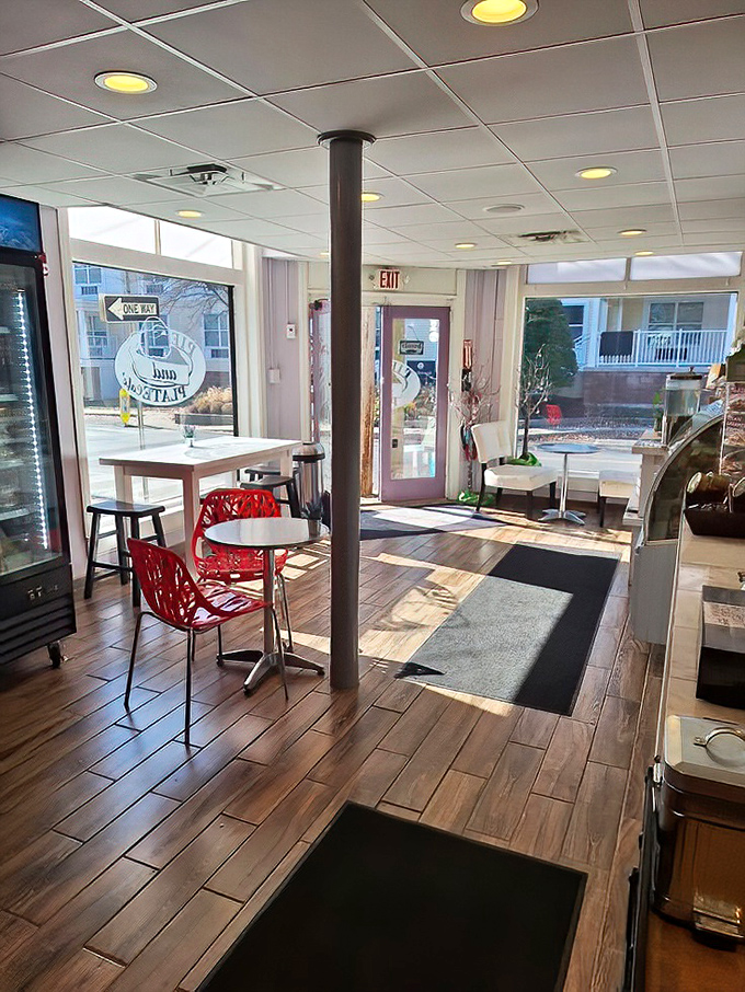 Clean lines and warm wood floors create the kind of inviting space where lingering over coffee feels mandatory.