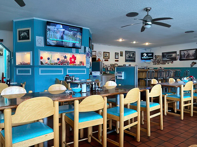 Wooden chairs with turquoise cushions line the counter, where breakfast dreams come true and coffee cups never stay empty for long.