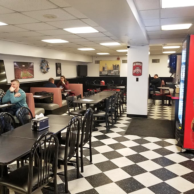 Classic checkered floors and red booths create the perfect stage for sandwich theater to unfold magnificently.