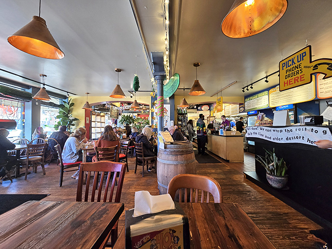 Warm lighting and wooden tables create the perfect backdrop for serious sandwich consumption and even more serious conversation.