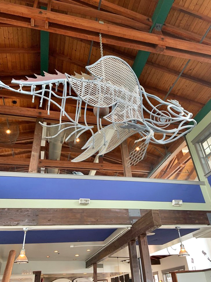 That wire sea dragon hanging from the ceiling isn't just decoration—it's a warning to other seafood that their delicious fate awaits below.