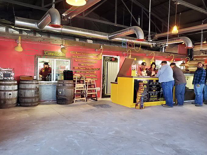 Inside, the industrial-chic space with wooden barrels and exposed ductwork creates the perfect workshop atmosphere for serious meat artisans.