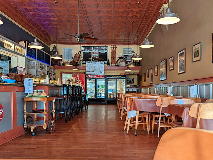 Step inside to discover that magical small-town atmosphere where the copper-toned ceiling reflects warmth onto wooden floors that have supported generations of satisfied diners.