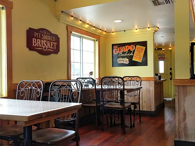 Inside, wooden accents and string lights create that perfect "I'm about to eat something life-changing" atmosphere. That brisket sign isn't kidding.