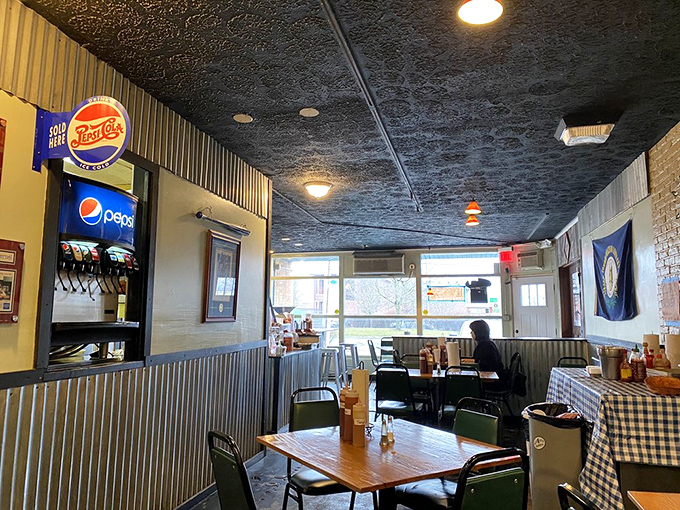 Inside, corrugated metal meets comfort. This isn't designer distressing&mdash;it's authentic smokehouse ambiance where the focus stays squarely on what matters: the meat.