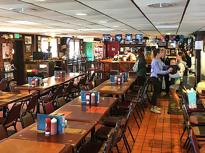 Simple wooden tables await the delicious chaos of a proper crab feast. No white tablecloths needed when the food's this good.