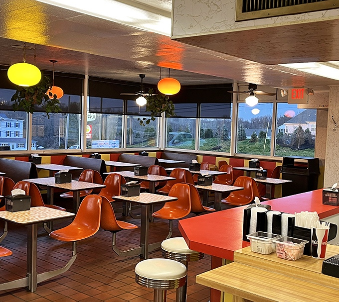 Step inside to find orange molded chairs that haven't changed since the Brady Bunch was on television, creating a time capsule where comfort food reigns supreme.