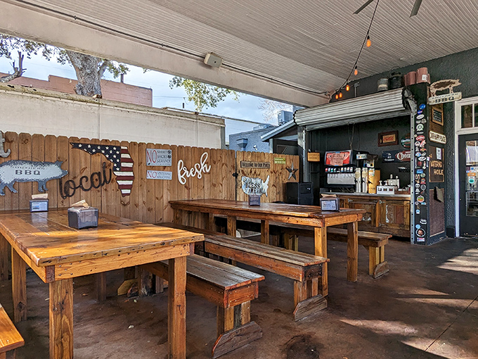 Rustic wooden tables and benches create the ideal setting for serious meat contemplation, where strangers become friends over shared barbecue revelations.