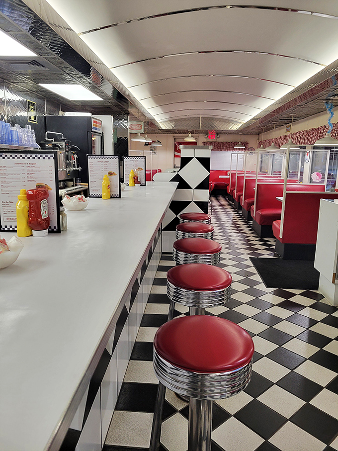 Step inside and you're transported to the golden age of diners &ndash; red vinyl booths, checkered floors, and counter seating that practically begs you to spin once before settling in.