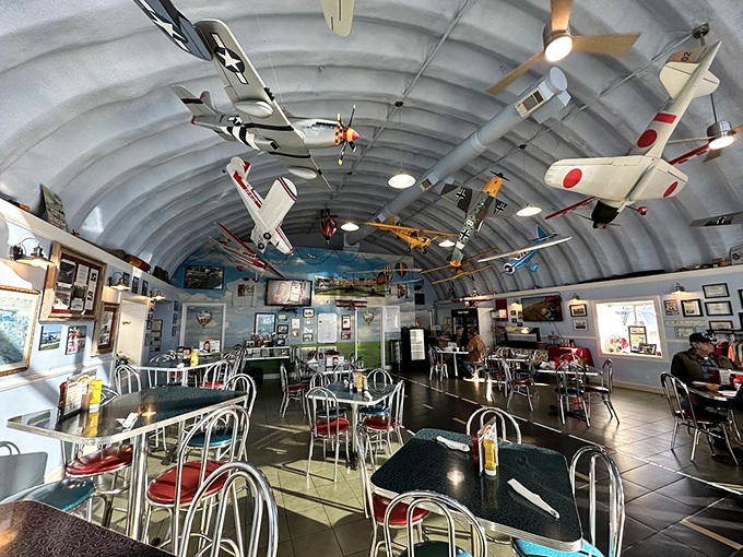 Look up! The ceiling of Hangar Kafe doubles as an aviation museum, with meticulously detailed model planes suspended above diners&mdash;breakfast with a side of history.